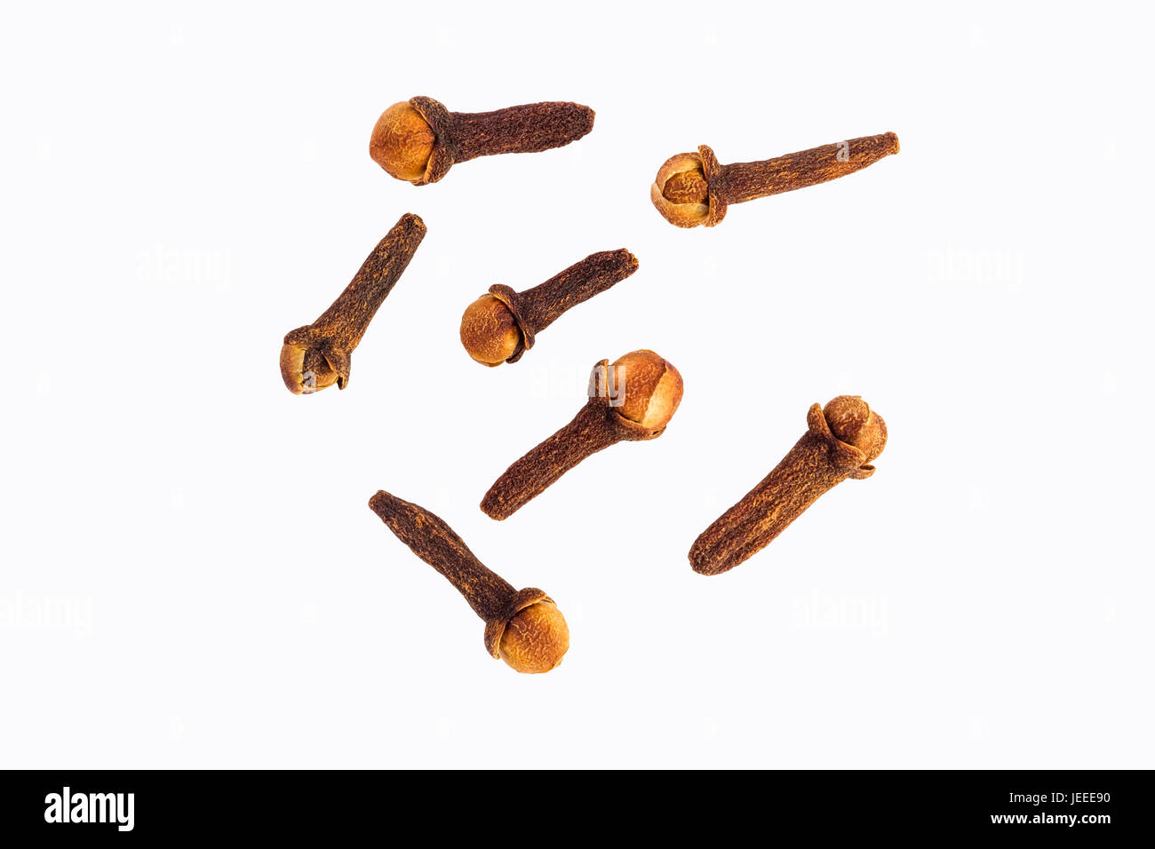 Cloves on white background Stock Photo - Alamy