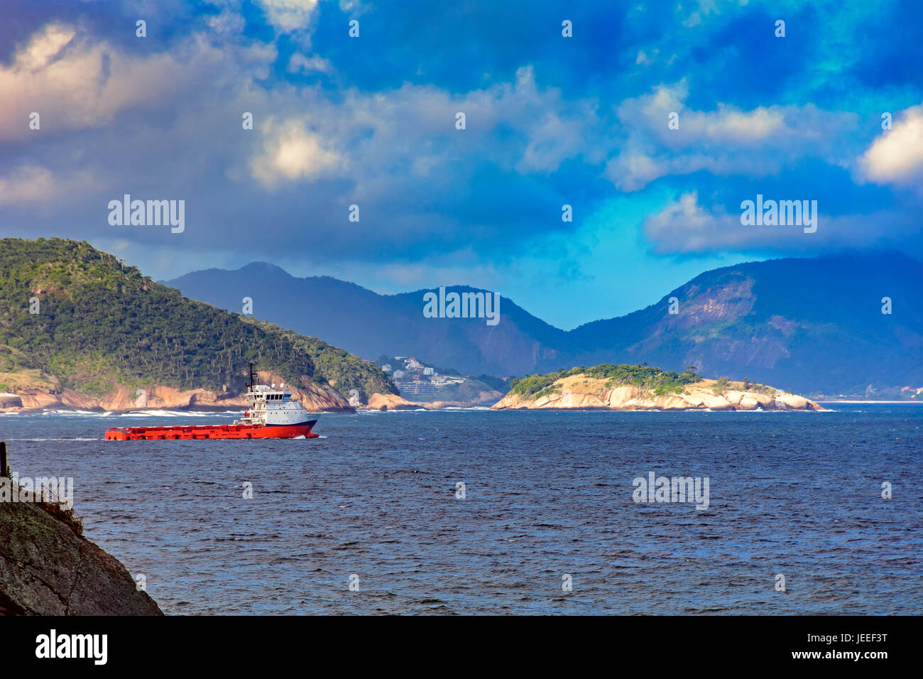 Ship sailing between islands, hills and forests of Guanabara bay in Rio ...