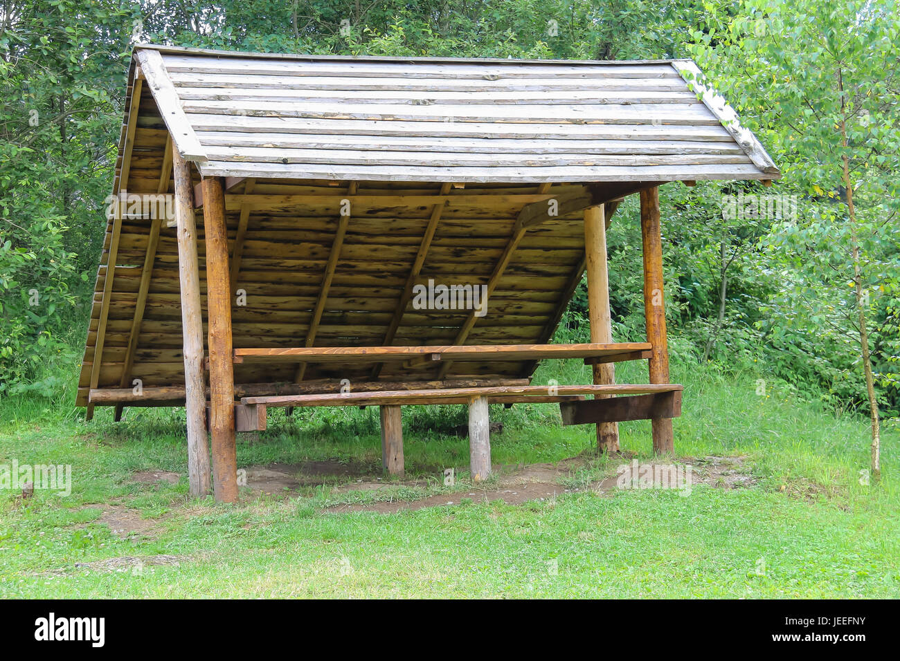 Old style wooden canopy with bench in forest park Stock Photo - Alamy