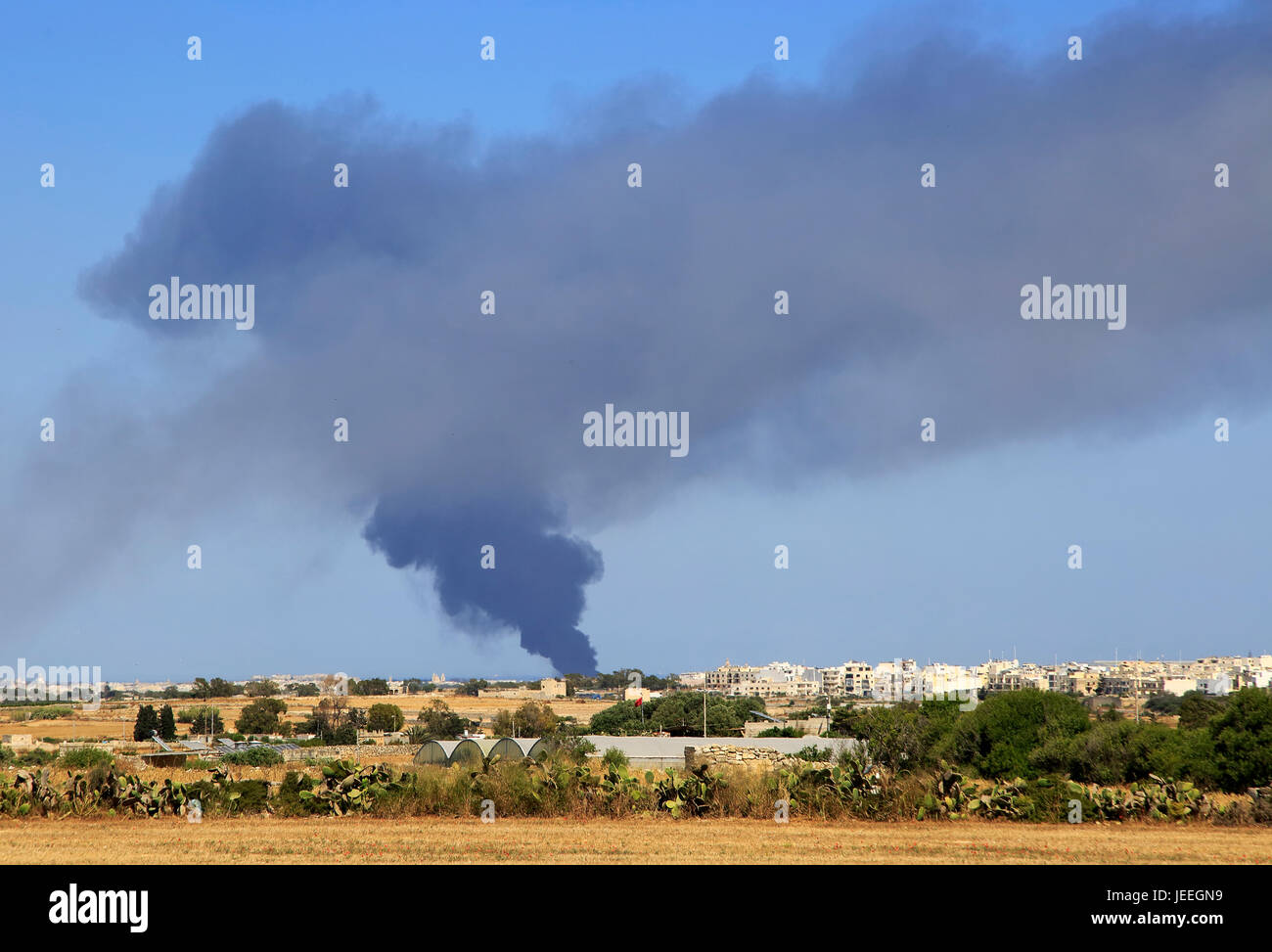 Smoke clouds atmospheric pollution from large fire at recycling centre ...