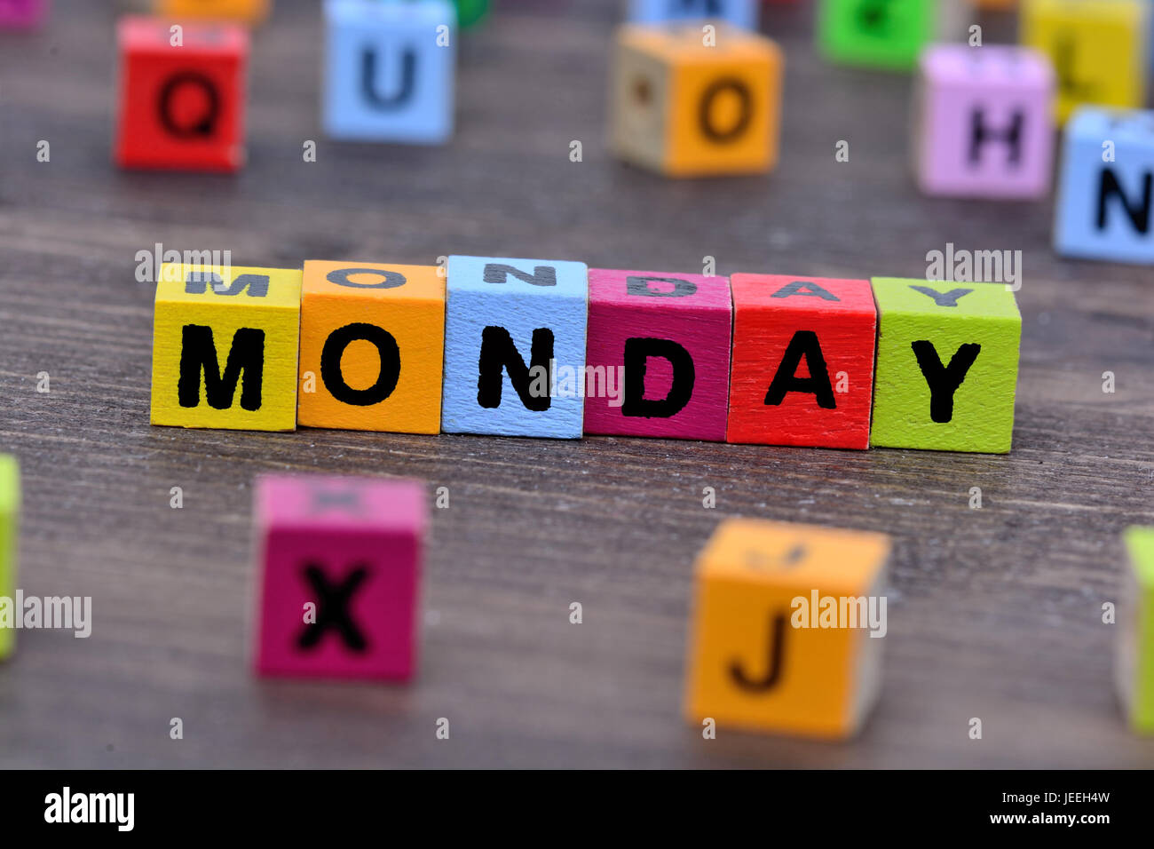 Monday word on wooden table Stock Photo - Alamy