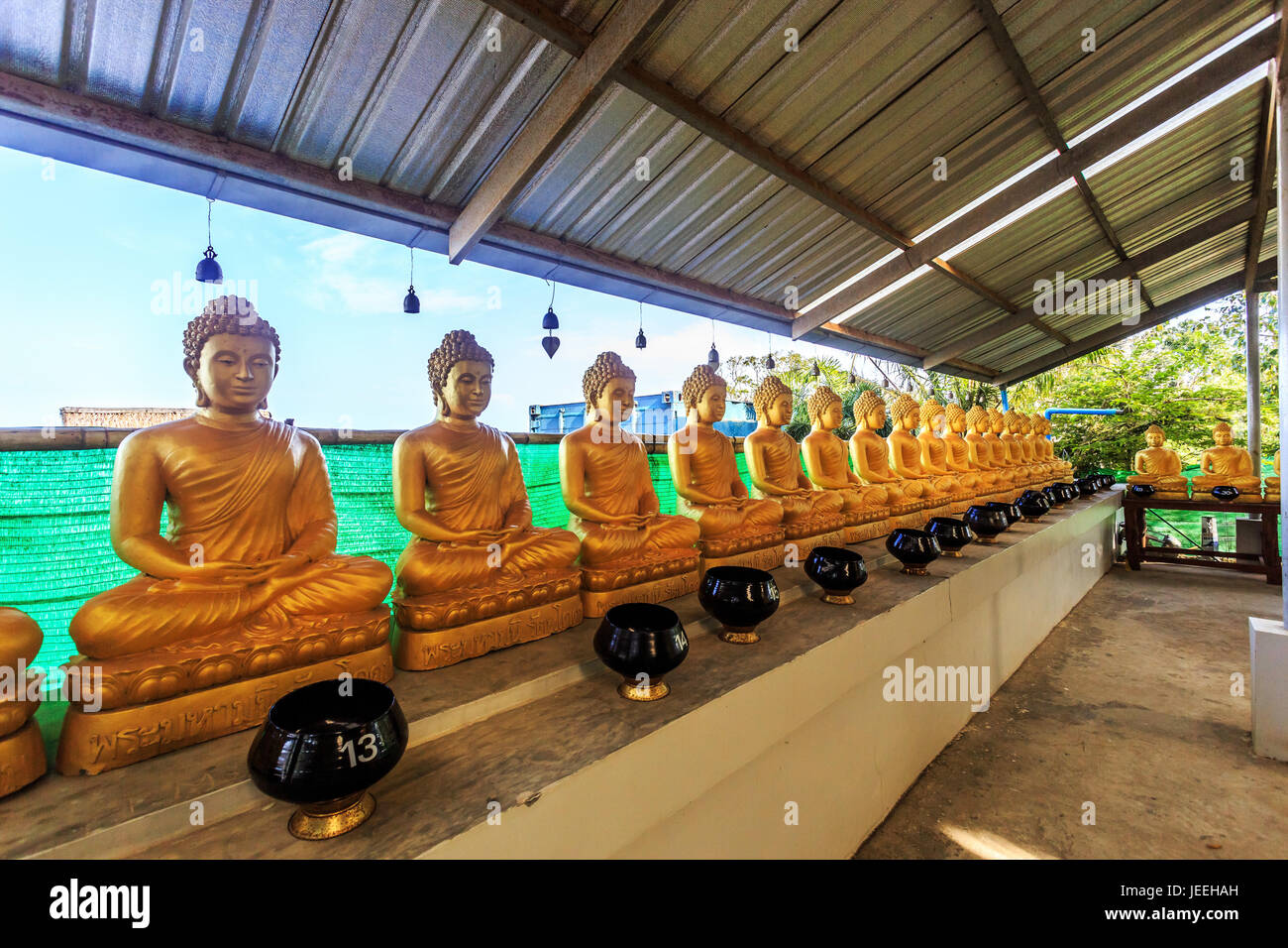 Golden Buddha row in Big Buddha temple. Phuket, Thailand Stock Photo ...