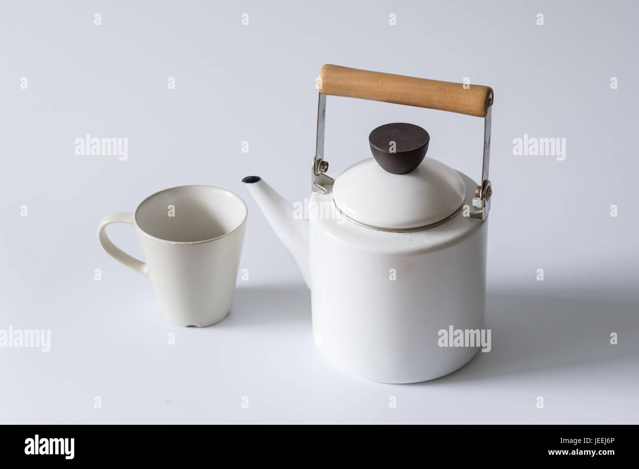 White kettles and cups, indoors Stock Photo - Alamy