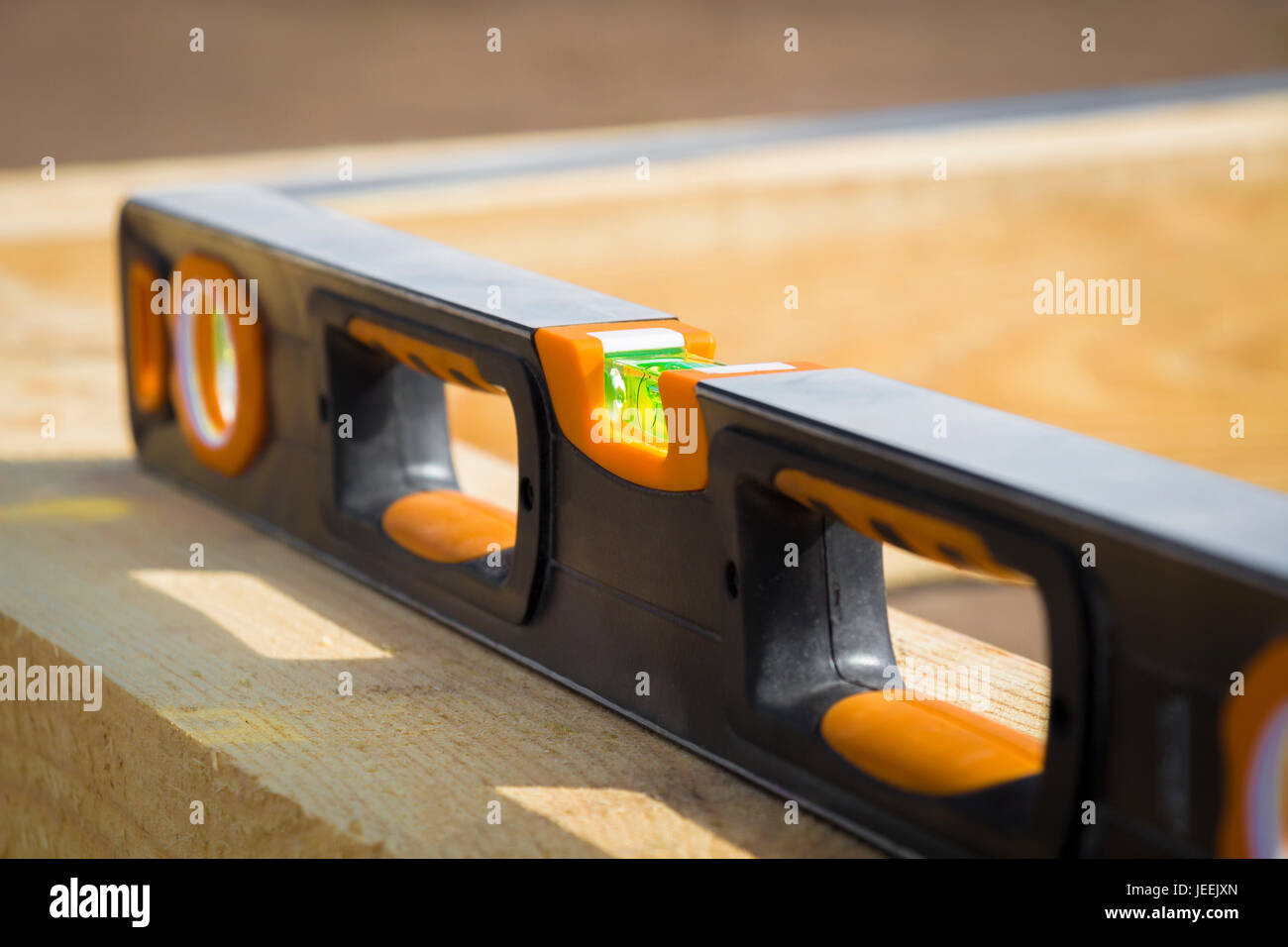 Tool measuring the level on a wooden truss construction closeup Stock ...