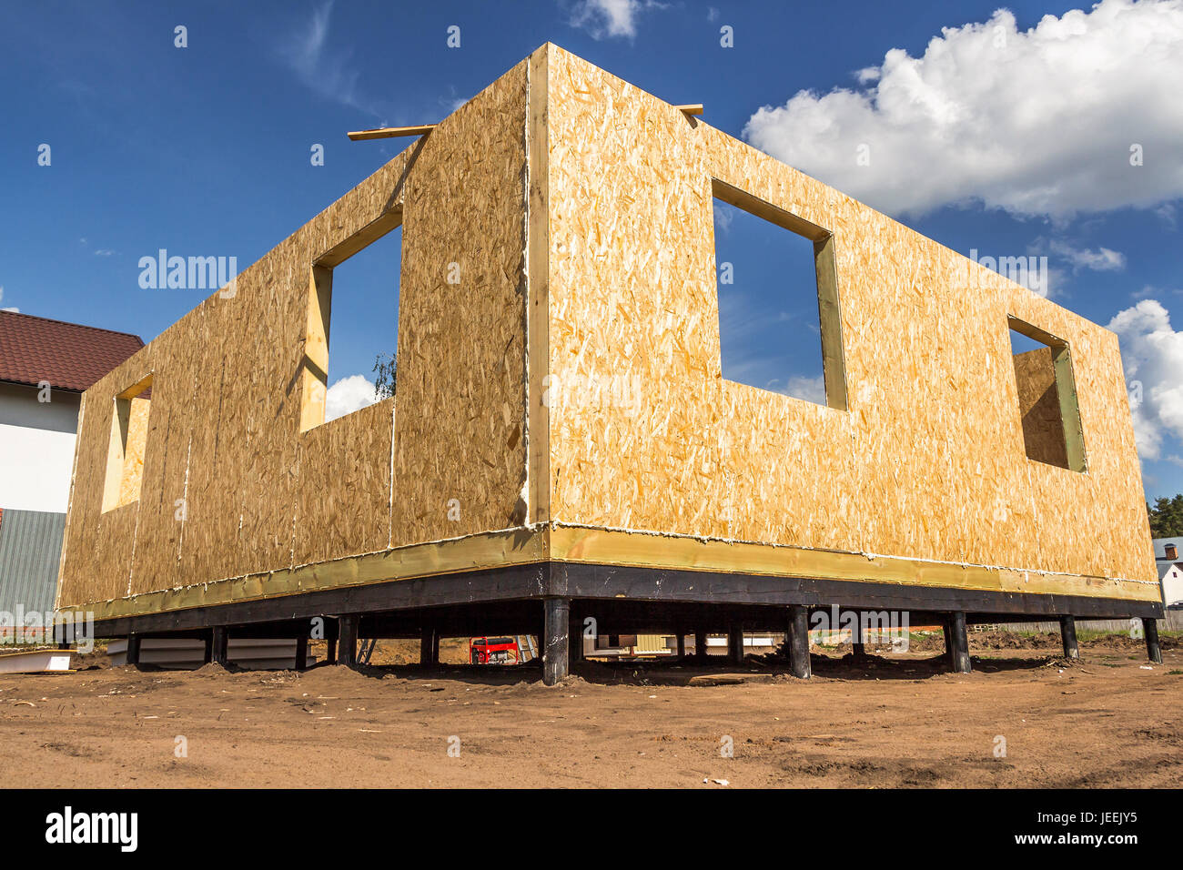 Assembling a small house of SIP panels Stock Photo - Alamy