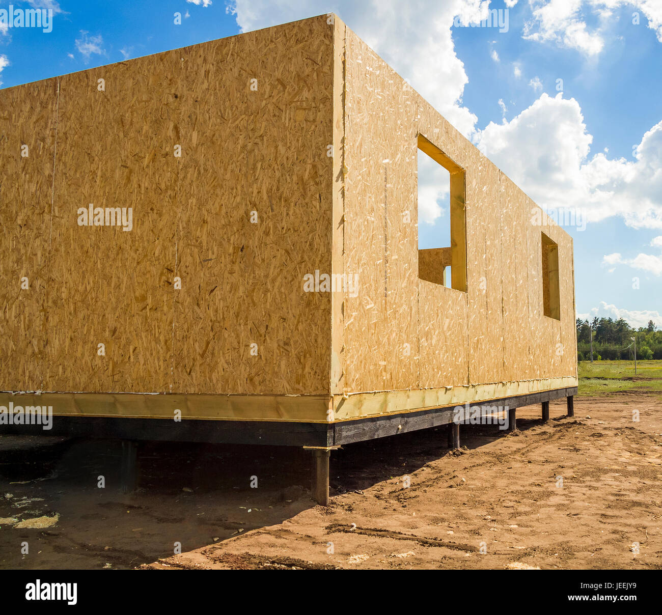 Assembling a small house of SIP panels Stock Photo - Alamy