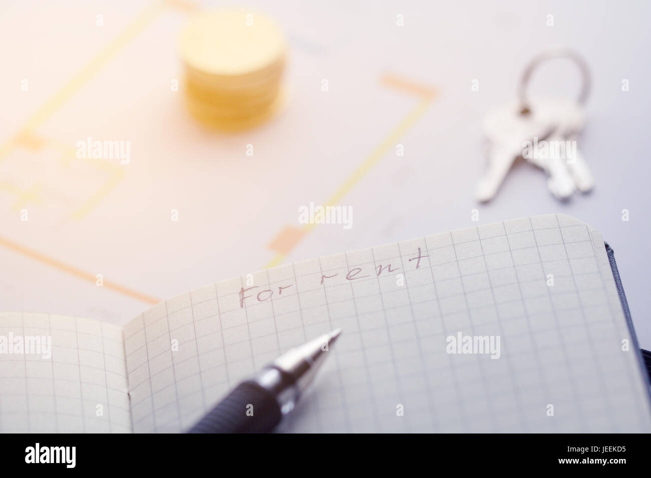 Floor plan on paper. Rental. Toned image Stock Photo - Alamy