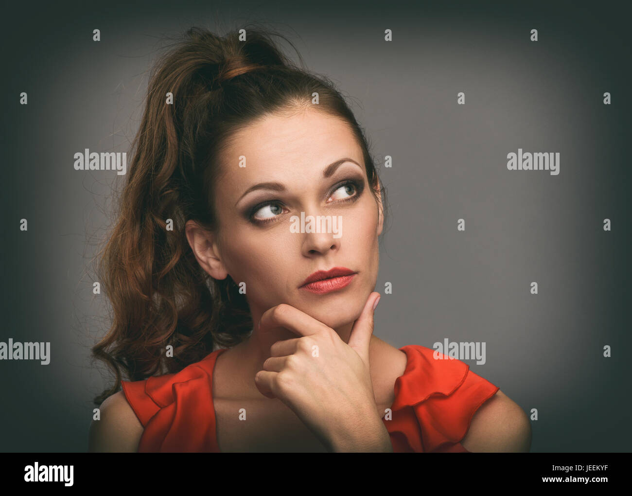 pretty woman thinking. Thoughtful Girl looking up Stock Photo - Alamy
