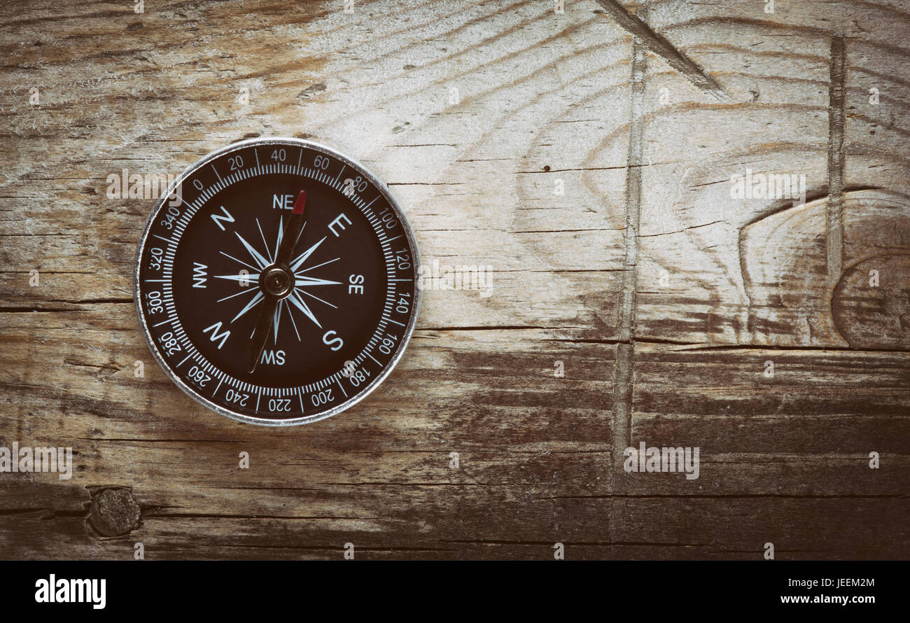 top view of compass on wooden background Stock Photo - Alamy