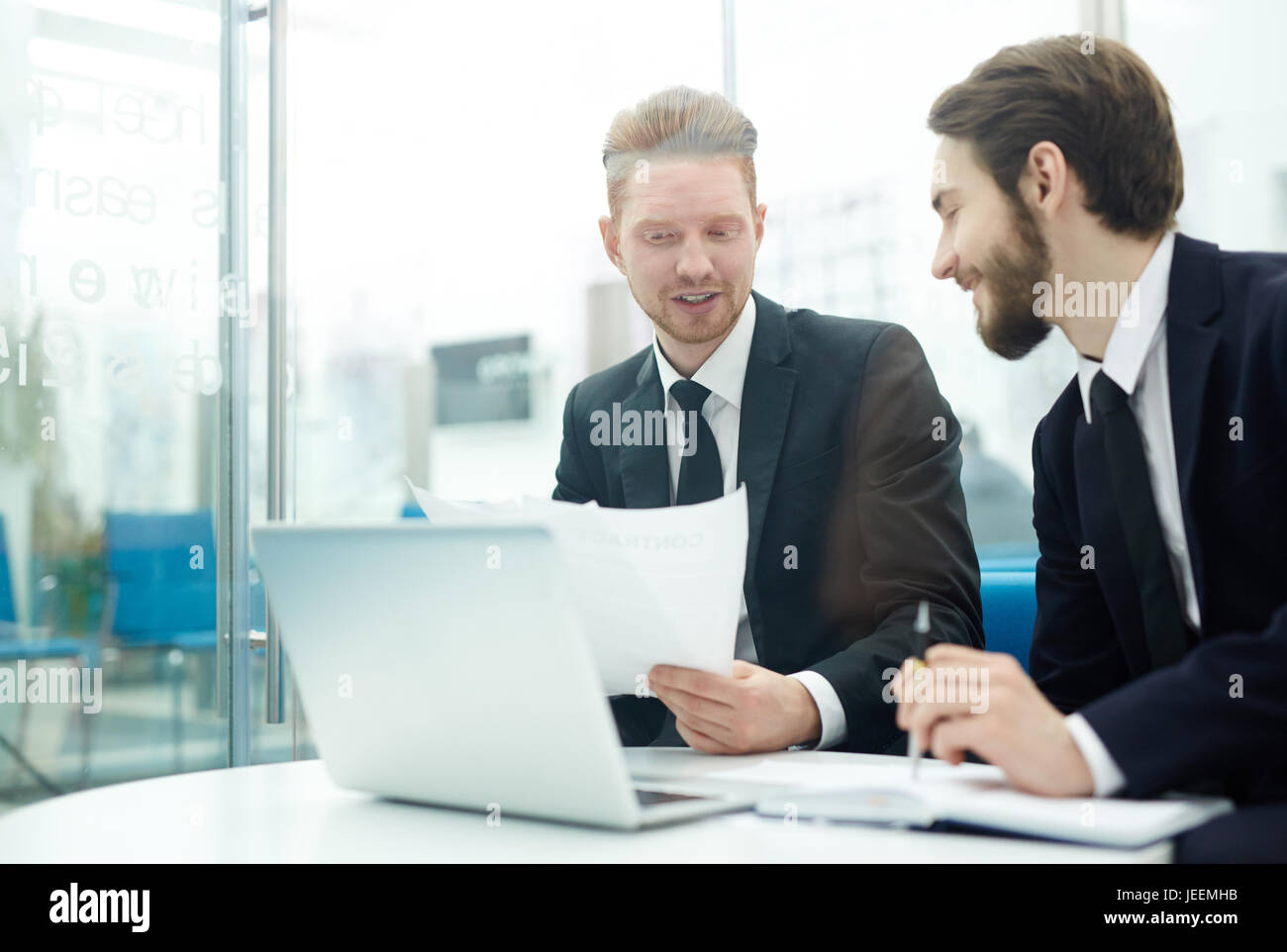 Briefing of two young financial managers Stock Photo - Alamy