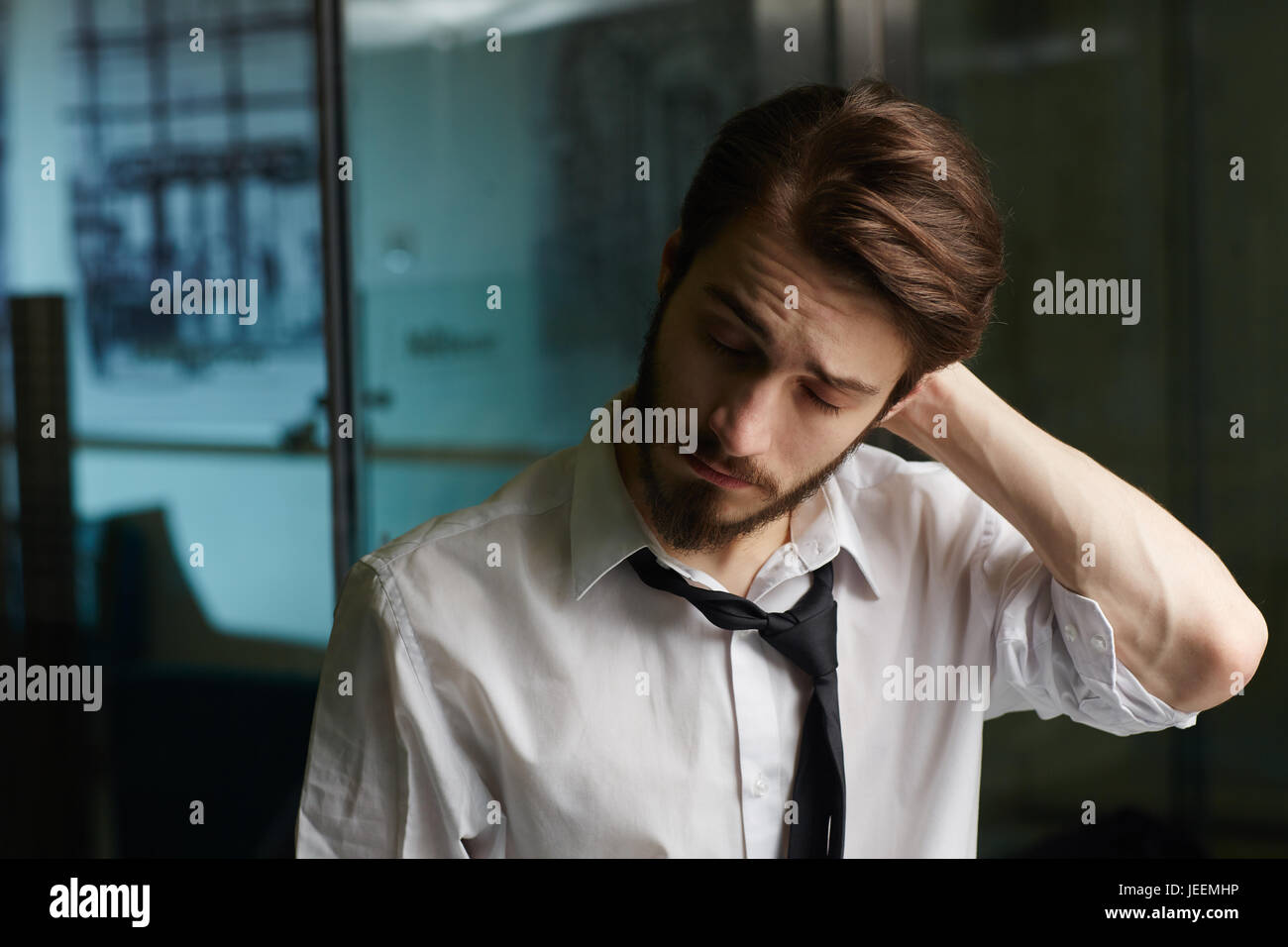 Very tired businessman staying in office at night Stock Photo - Alamy