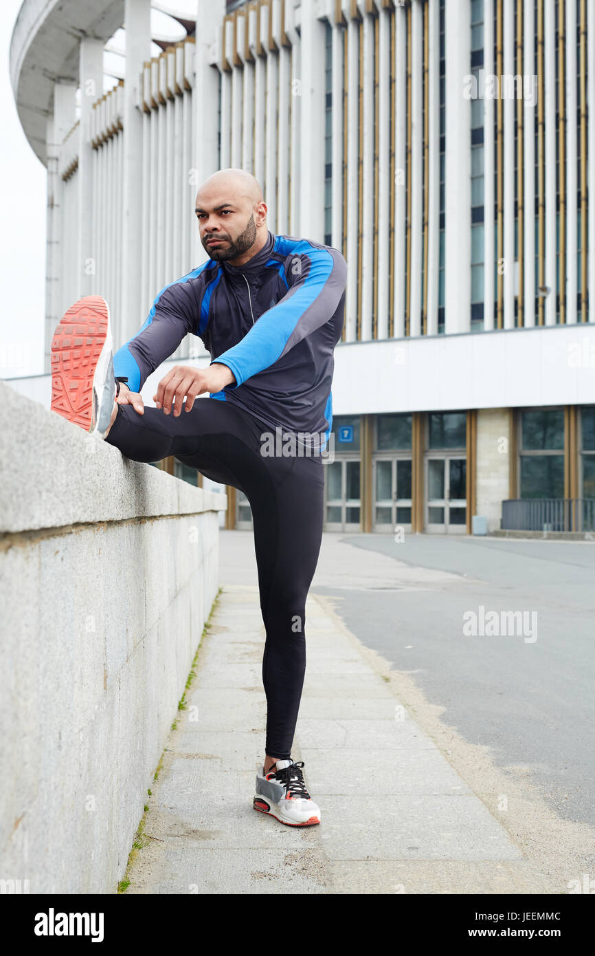 Healthy and active man making physical exercise outdoors Stock Photo ...