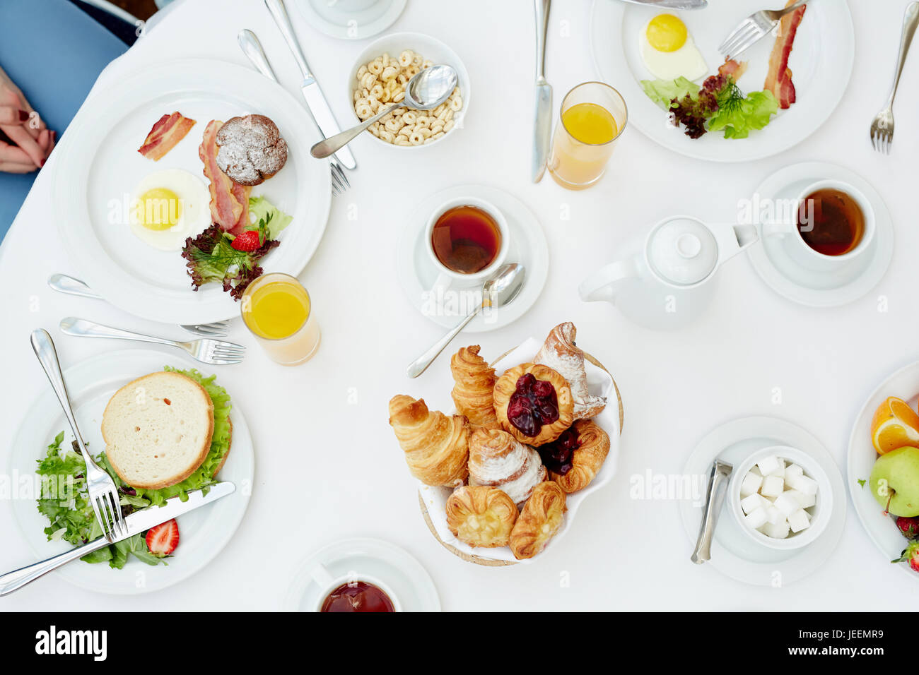 Served table with food and drinks for breakfast Stock Photo - Alamy