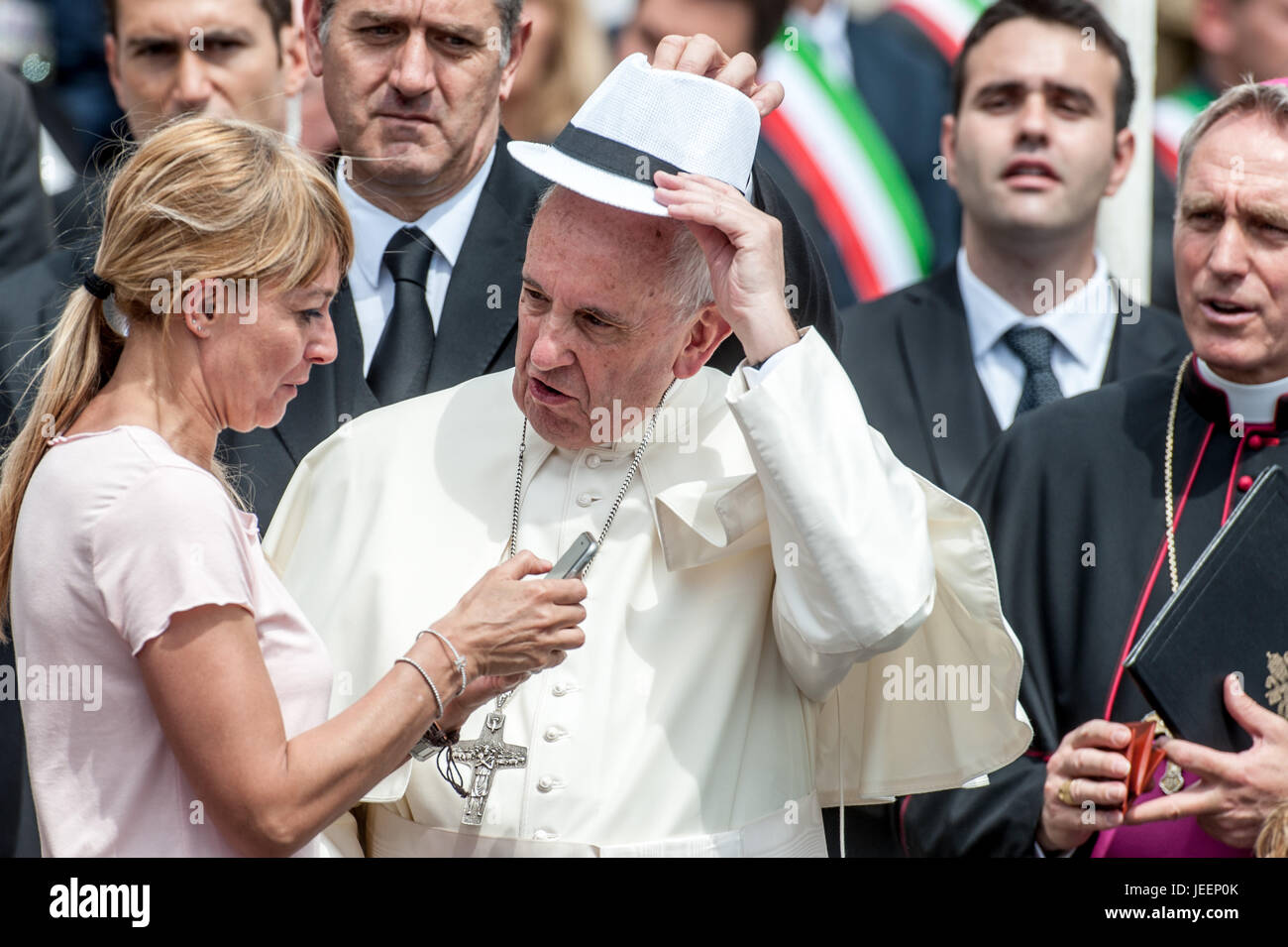 Pope Francis wears a white hat during his weekly general audience in St ...