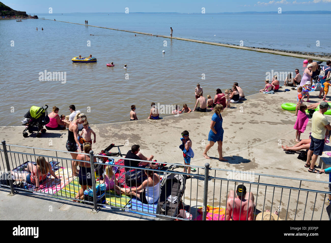 Summer seaside family visit to Clevedon marine lake, North Somerset, UK ...