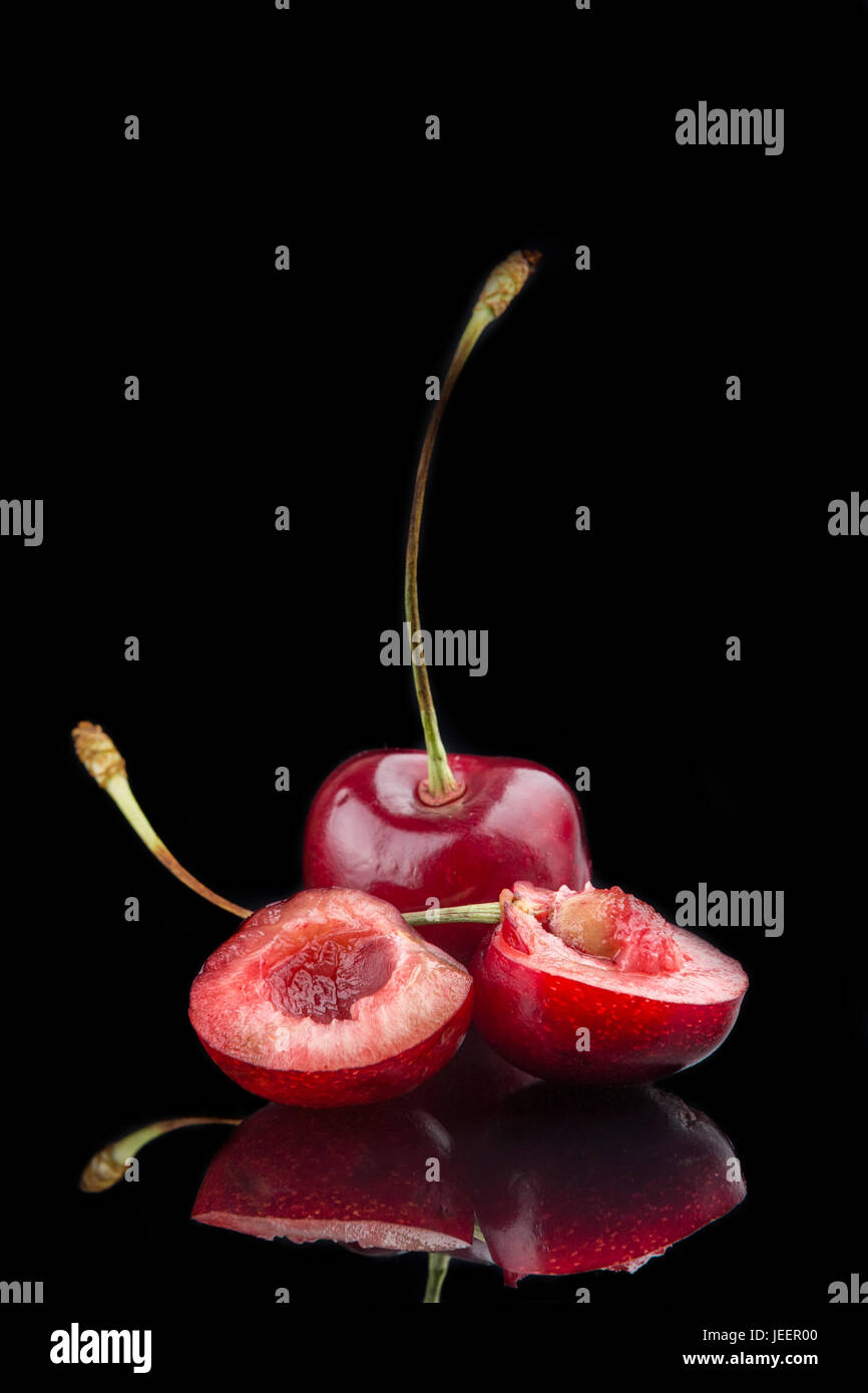 Cherry with reflection on a black background Stock Photo - Alamy