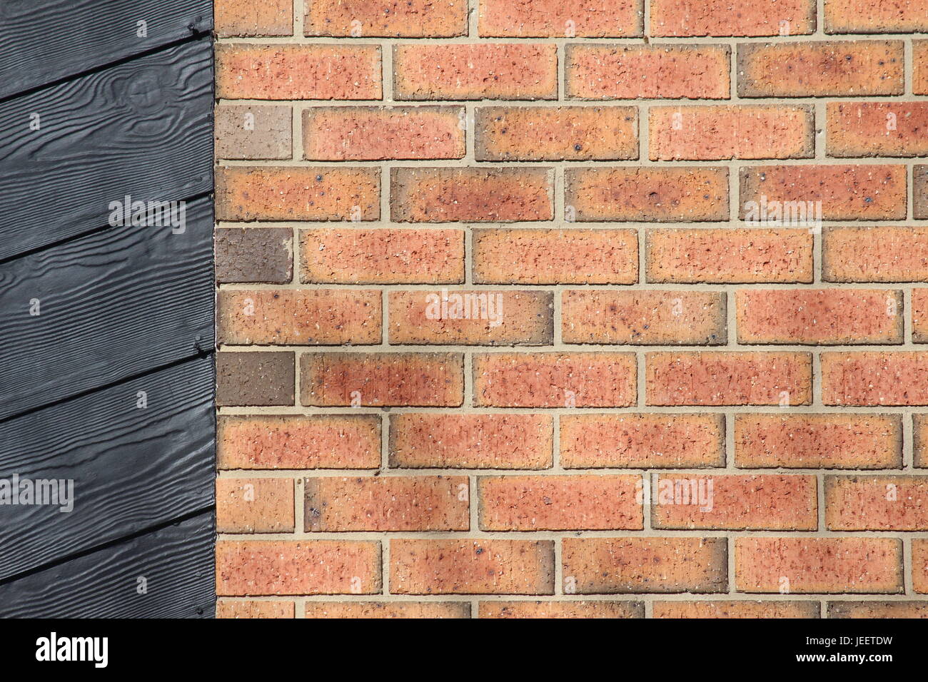 Junction between brick wall and timber panelling in a suburb of ...