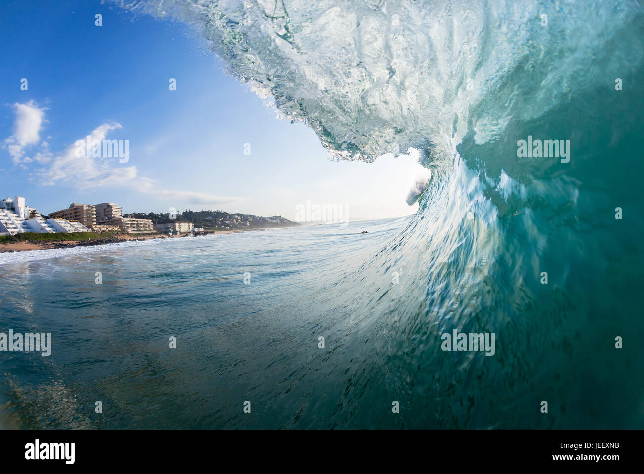 Ocean wave swimming inside water coastline of Ballito Bay apartments ...