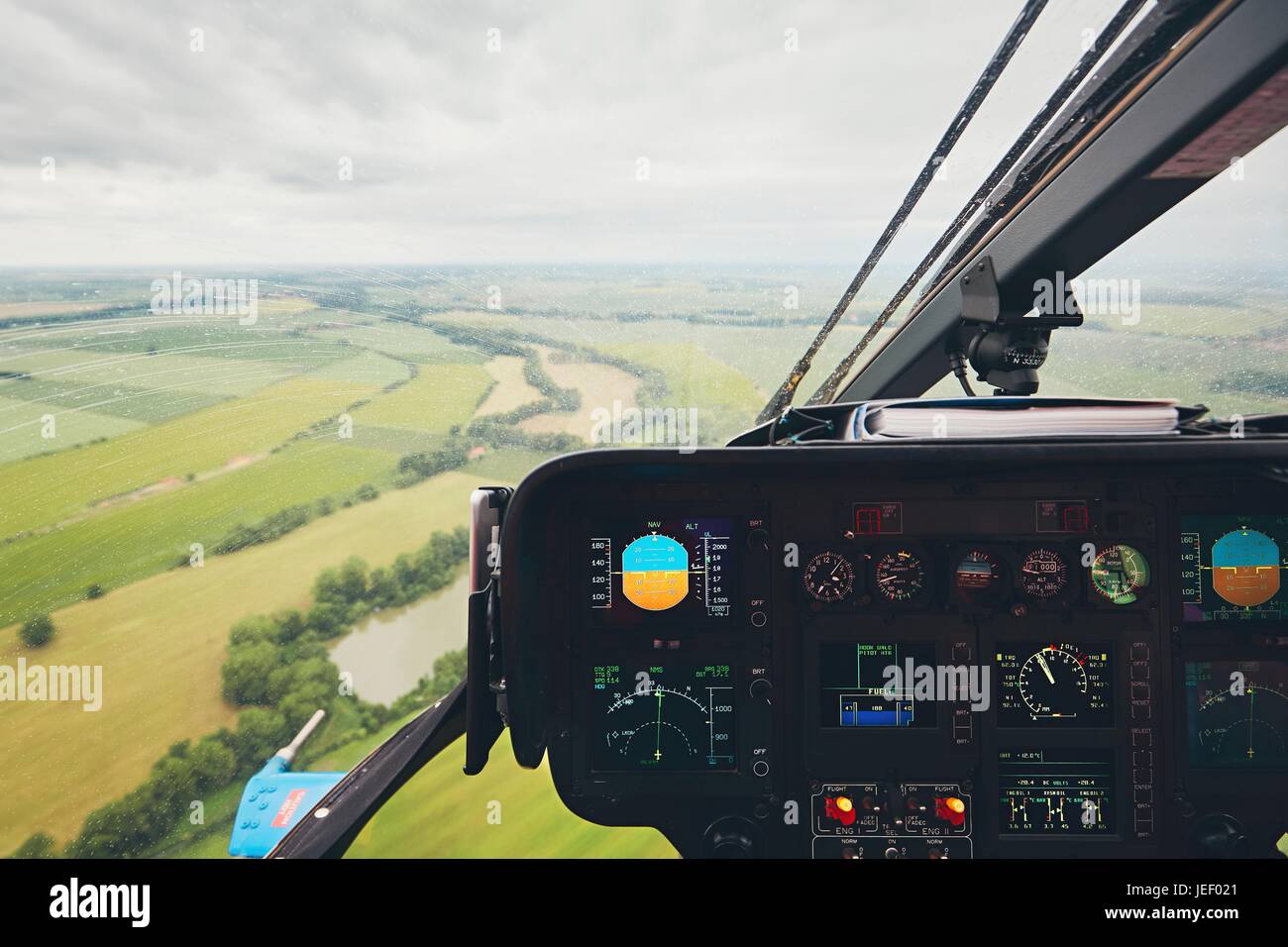 Flight in rainy weather. View from the helicopter of the emergency ...