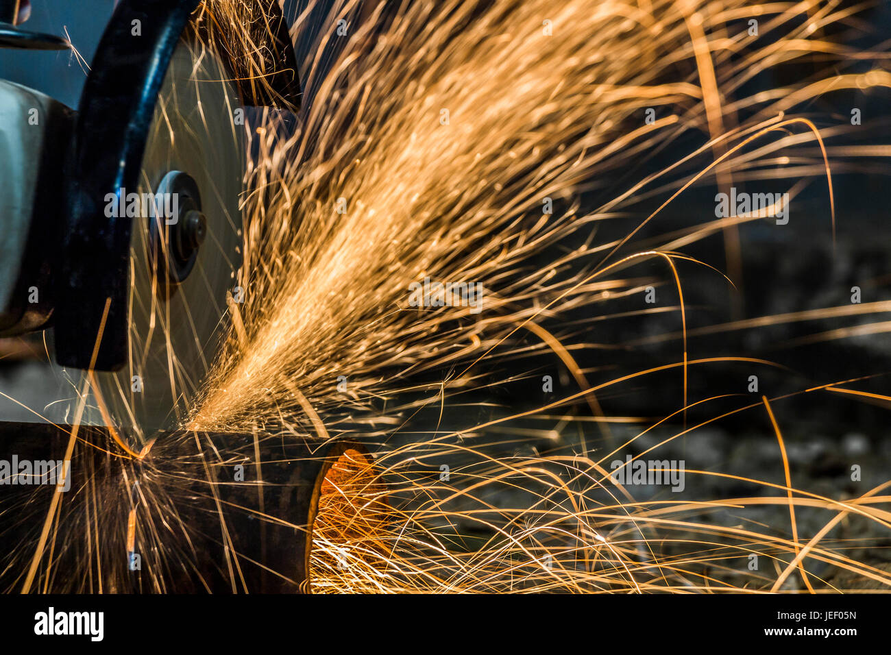 Sparks from cutting metal cutting tool manually Stock Photo - Alamy