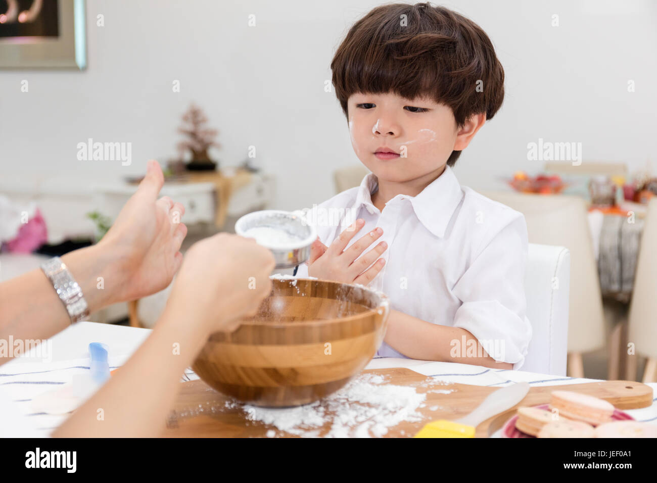 Asian family boy cooking hi-res stock photography and images - Alamy