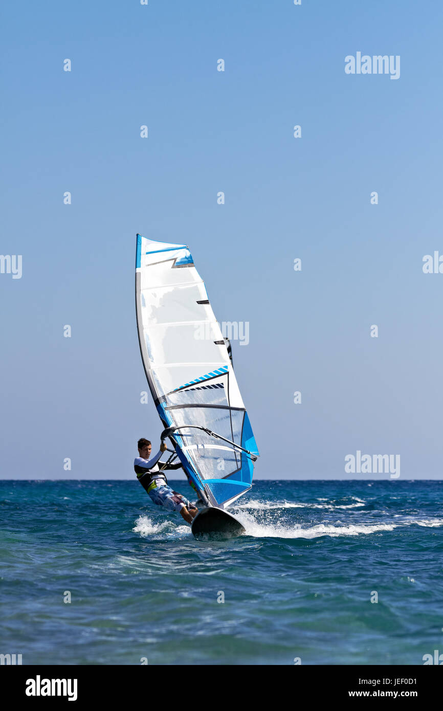 Front view of young man surfing the wind Stock Photo - Alamy