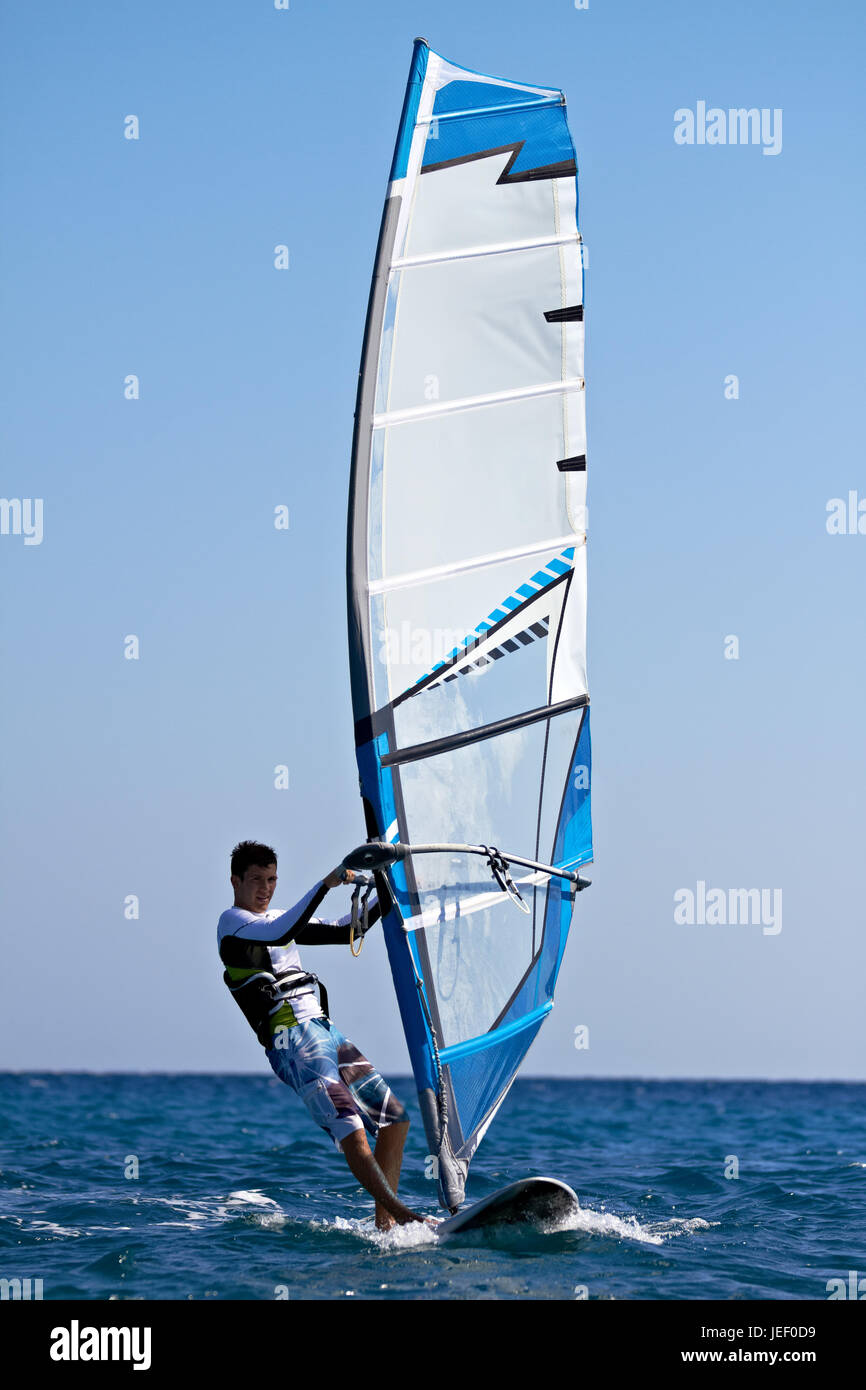 Front view of young man surfing the wind Stock Photo - Alamy