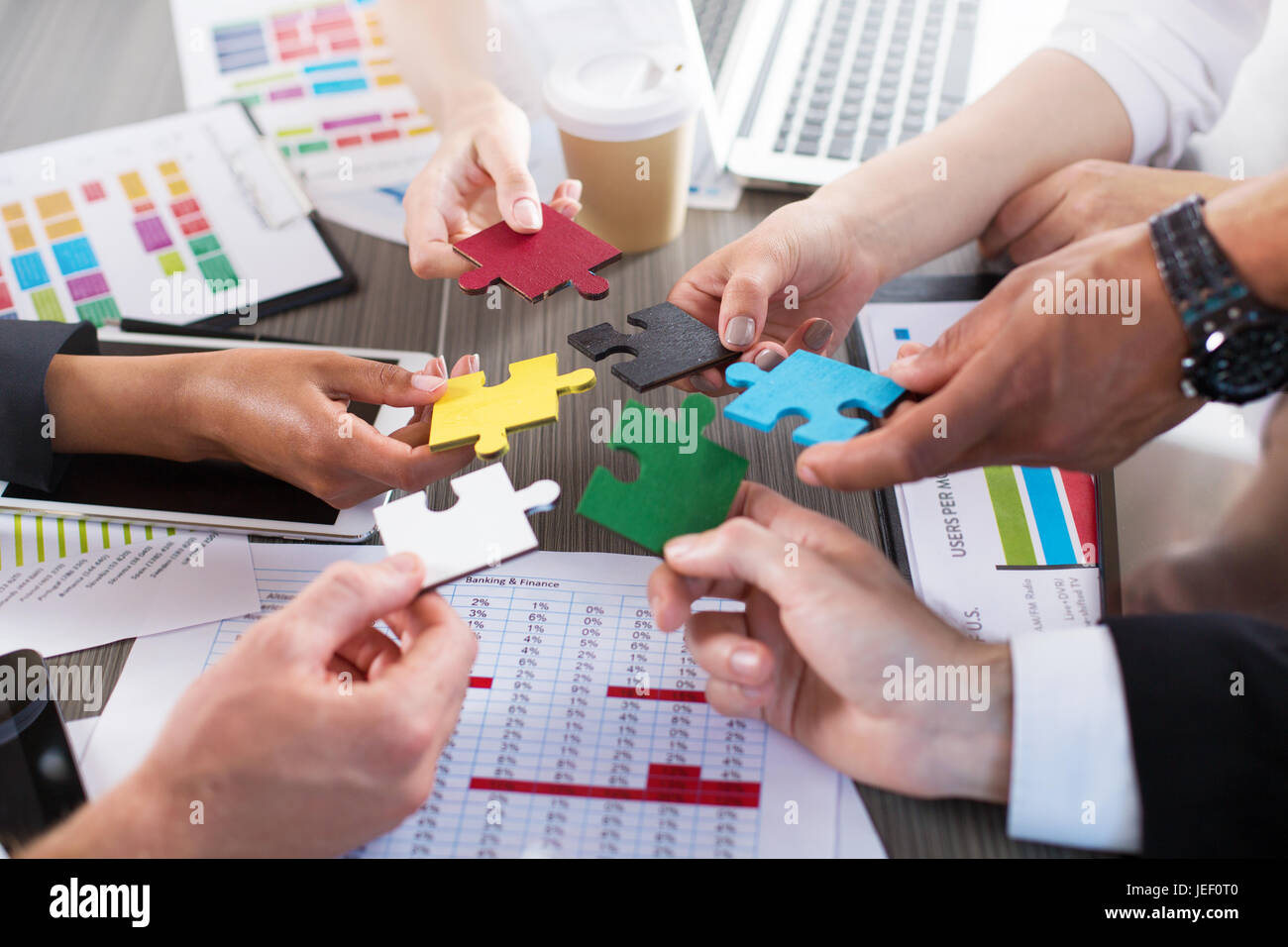 Teamwork of partners. Concept of integration and startup with puzzle ...