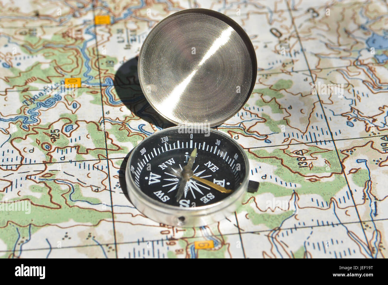 The compass lies on the map. Navigation tools needed for orientation ...