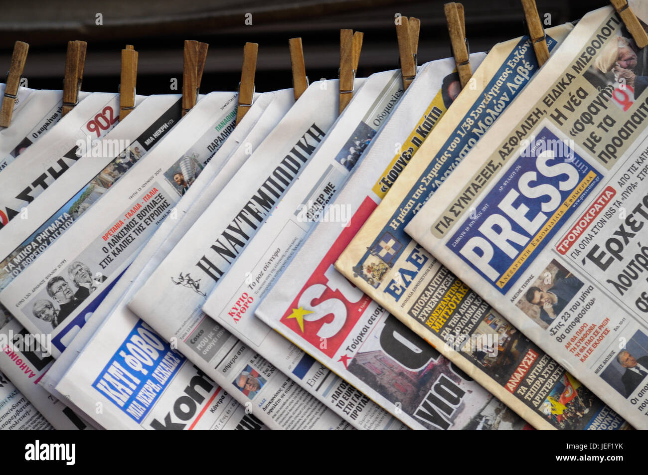 Greek newspapers on a clothesline in a newspapers shop of Athens ...