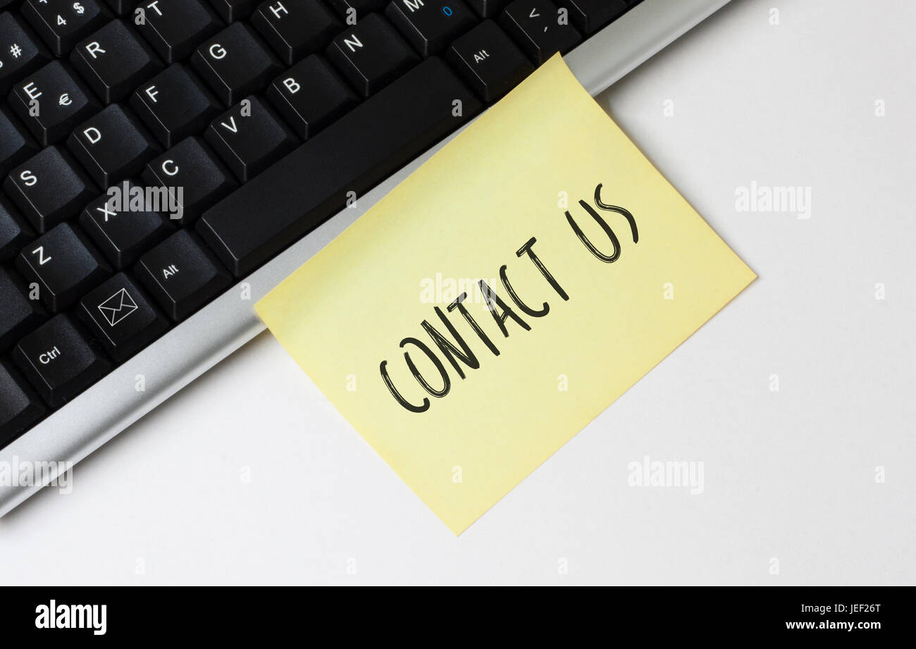 Keyboard and Contact Us Sticky Note on the White Desk Stock Photo - Alamy