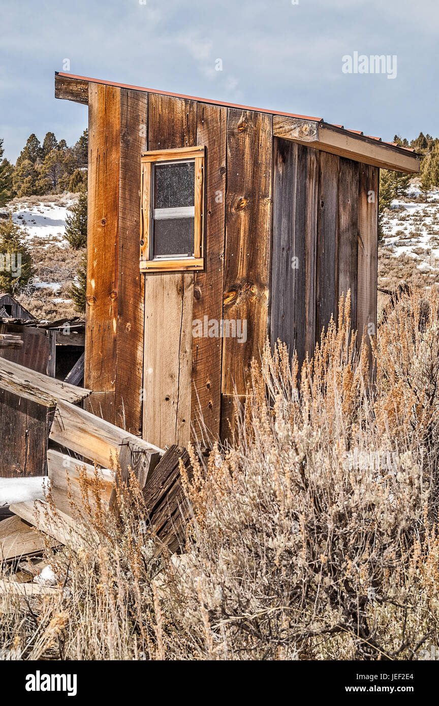 Outhouse in a ghost town that someone has updated with a new window ...