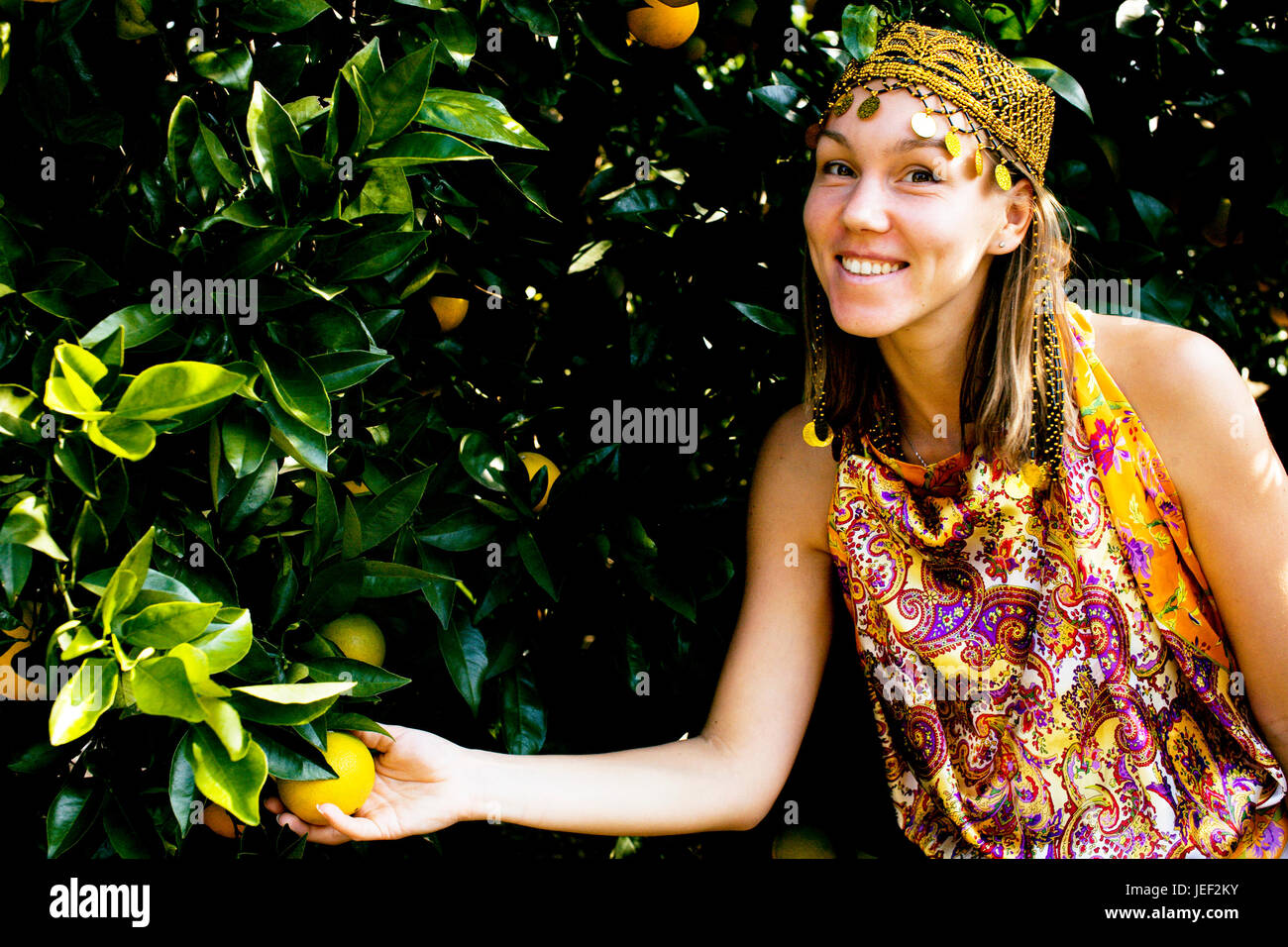 pretty islam woman in orange grove smiling, real muslim girl che Stock ...