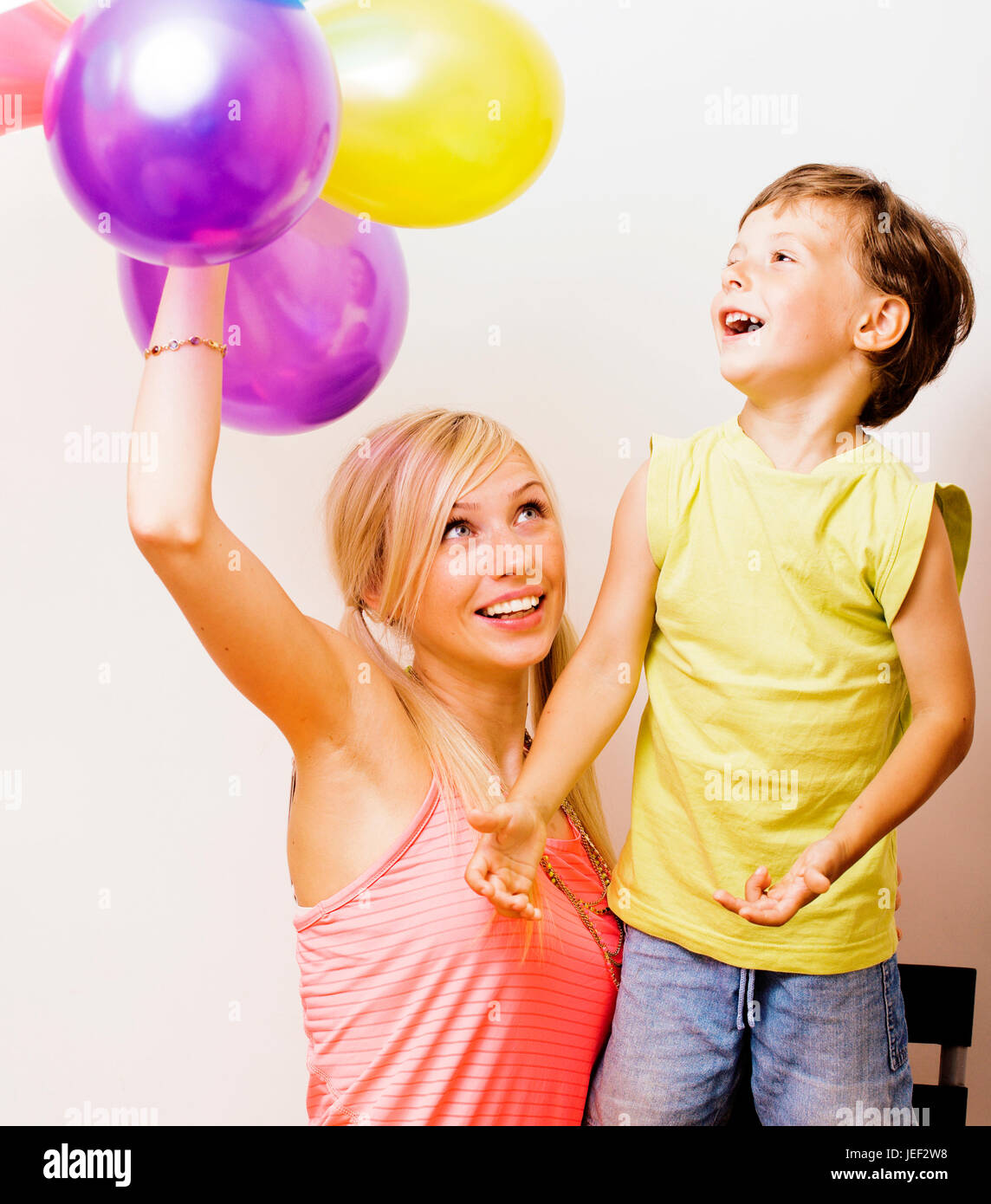 pretty real family with color balloons on white background, blon Stock ...