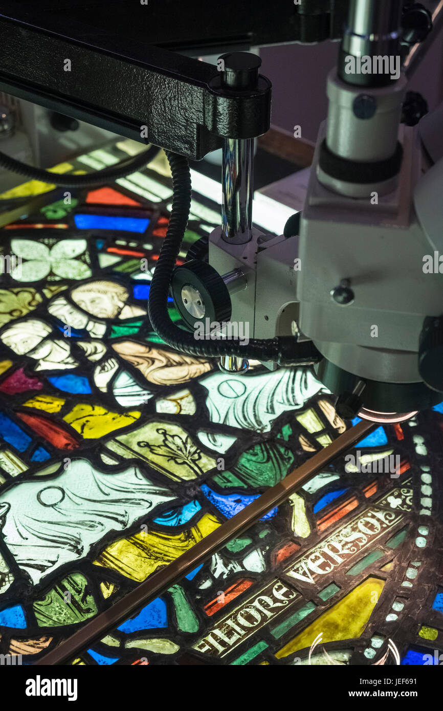 Detail of stained glass window being inspected with microscope ...