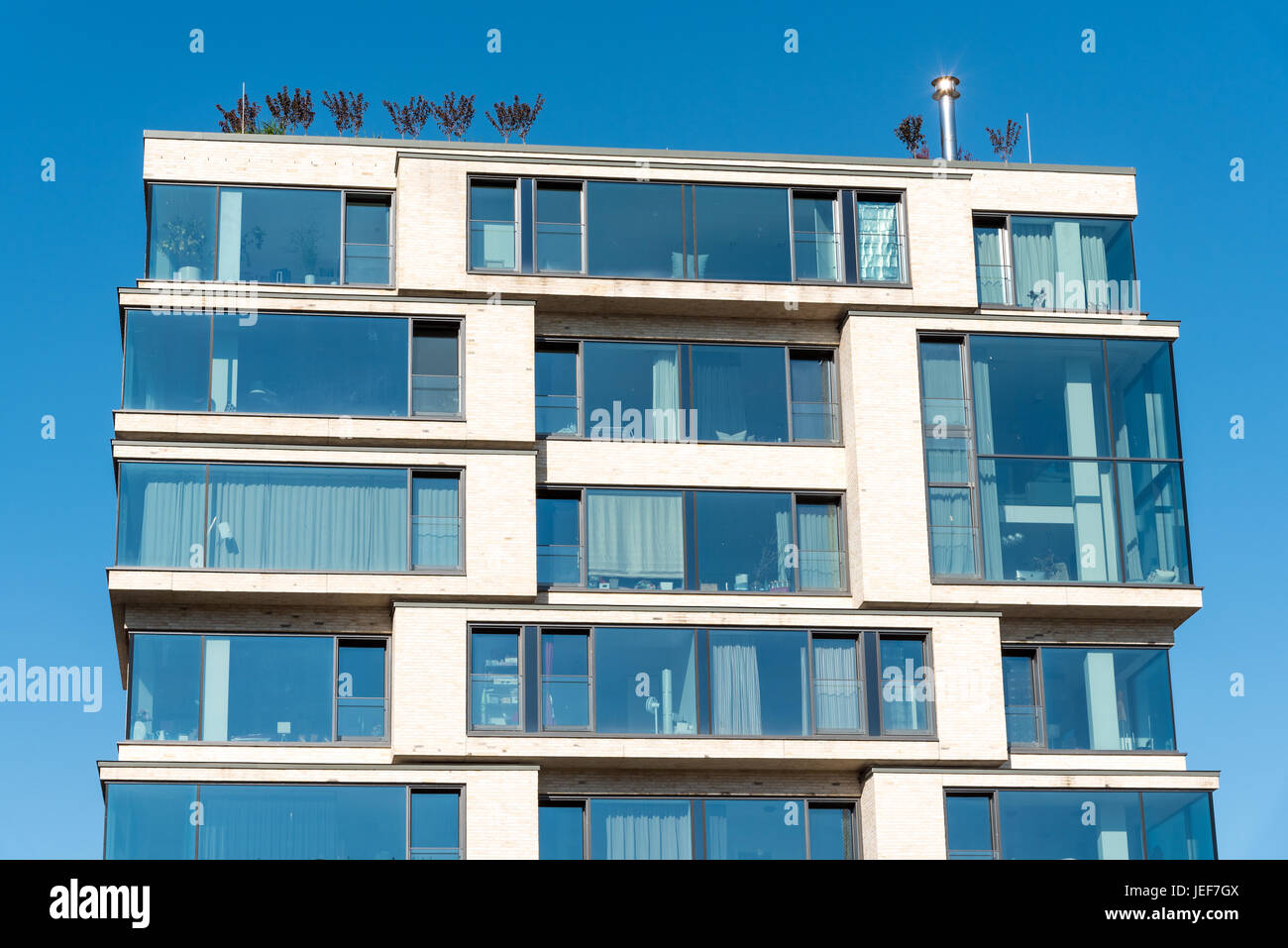 Modern apartment house with a lot of glass seen in Berlin, Germany ...