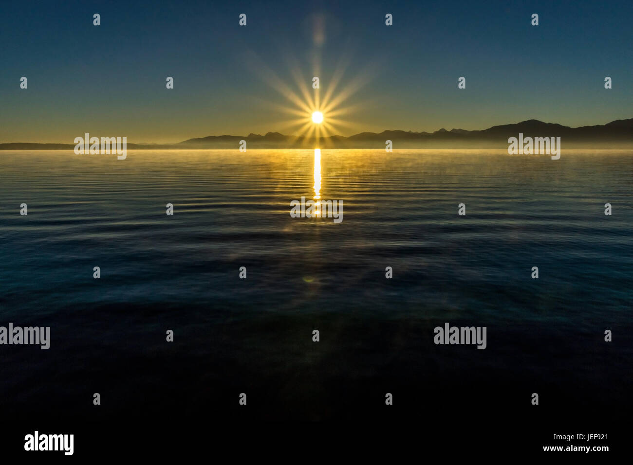 Accepted in Lake Chiem in Bavaria, Germany, in January. Footbridge in ...