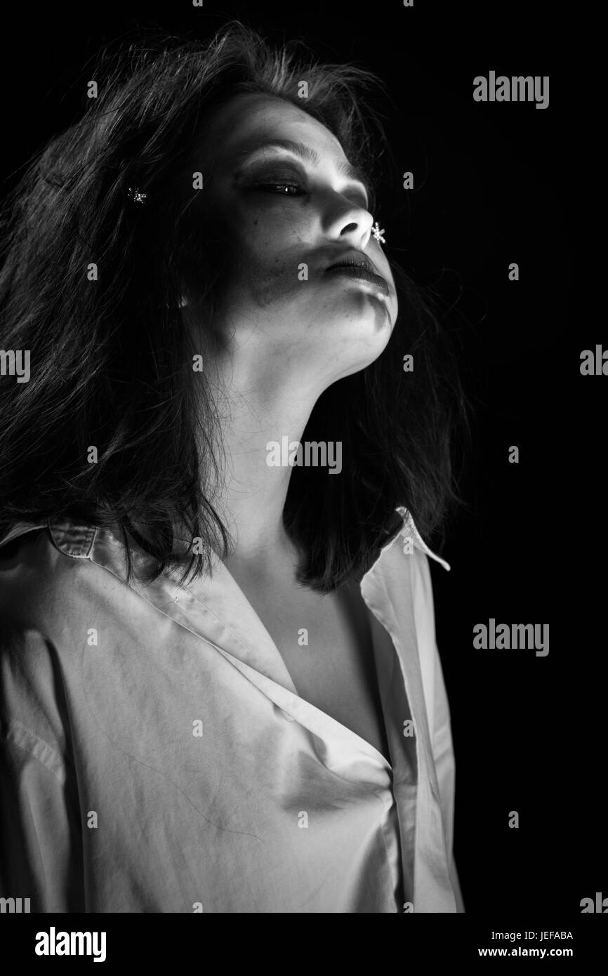 Pretty Fun Crazy Girl With Fluffy Hair And Smeared Cosmetics On Black Background Monochrome