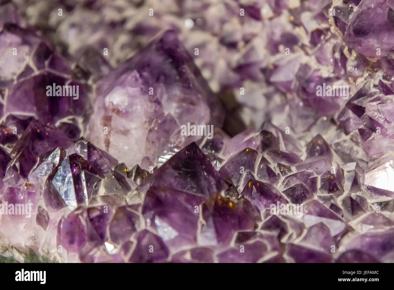 Natural amethyst crystal background Stock Photo - Alamy