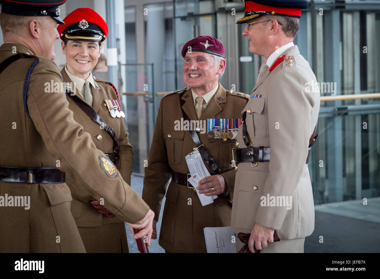 Officers talking and smiling Stock Photo - Alamy