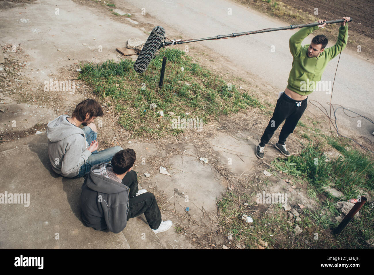 Actor behind the scene. Sound boom operator hold microphone fisher on ...