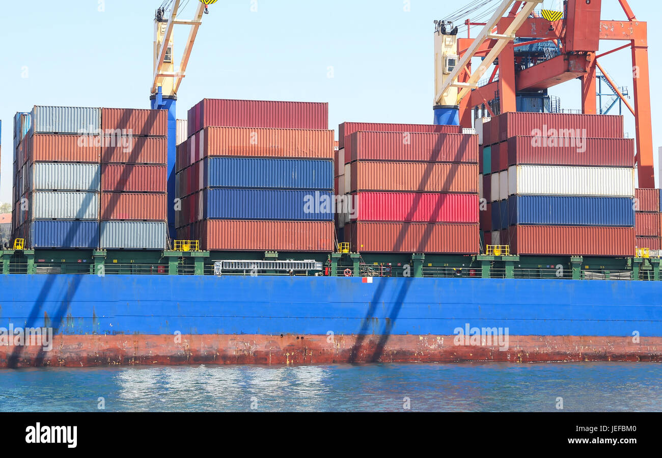 Container Ship is loading in a port Stock Photo - Alamy