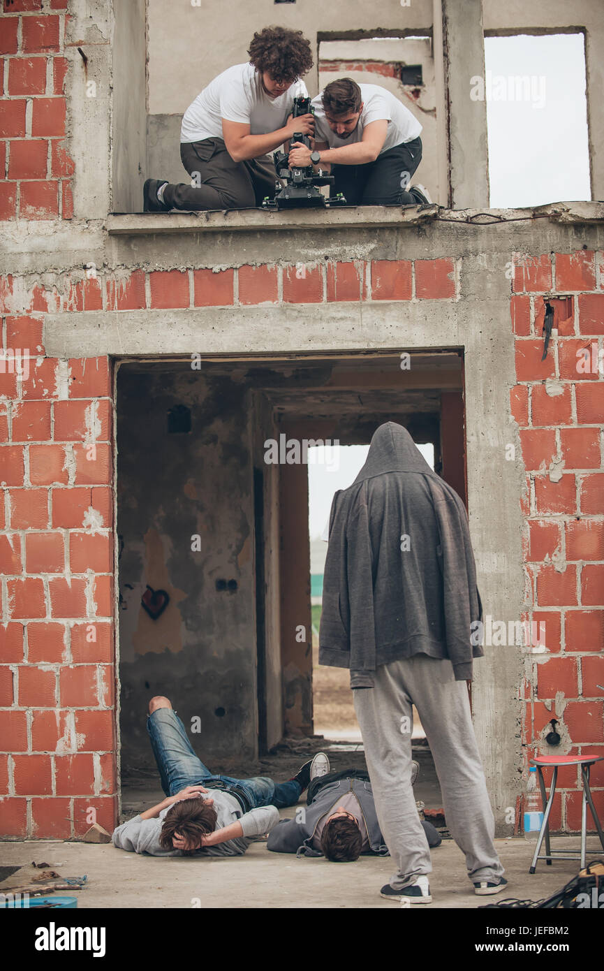 Behind the scene improvisation. Film crew team filming movie scene on ...