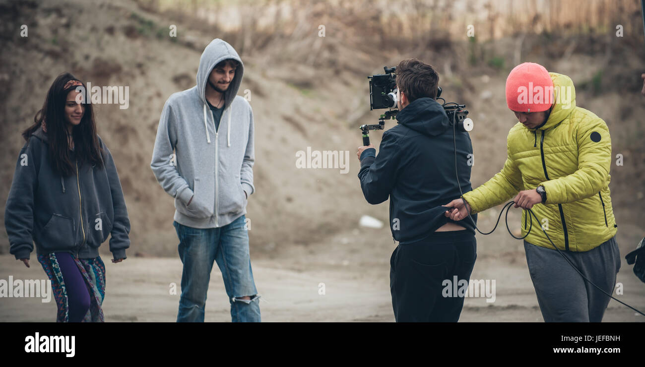 Behind the scene. Film crew team filming movie scene on outdoor ...