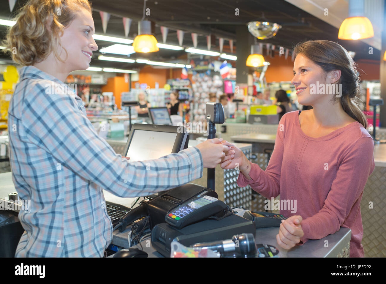 a employee of a hardware store at work Stock Photo - Alamy