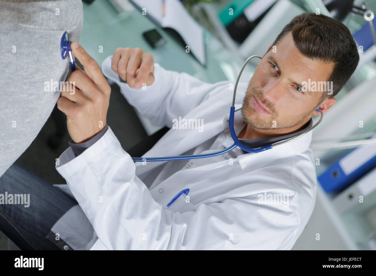 doctor holding stethoscope in his hand and doing auscultation Stock ...