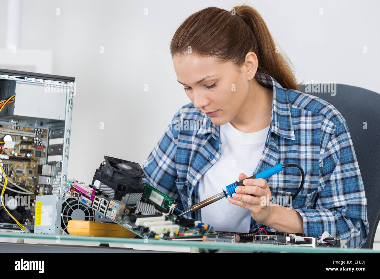 cute female engineer at home working on technology Stock Photo - Alamy