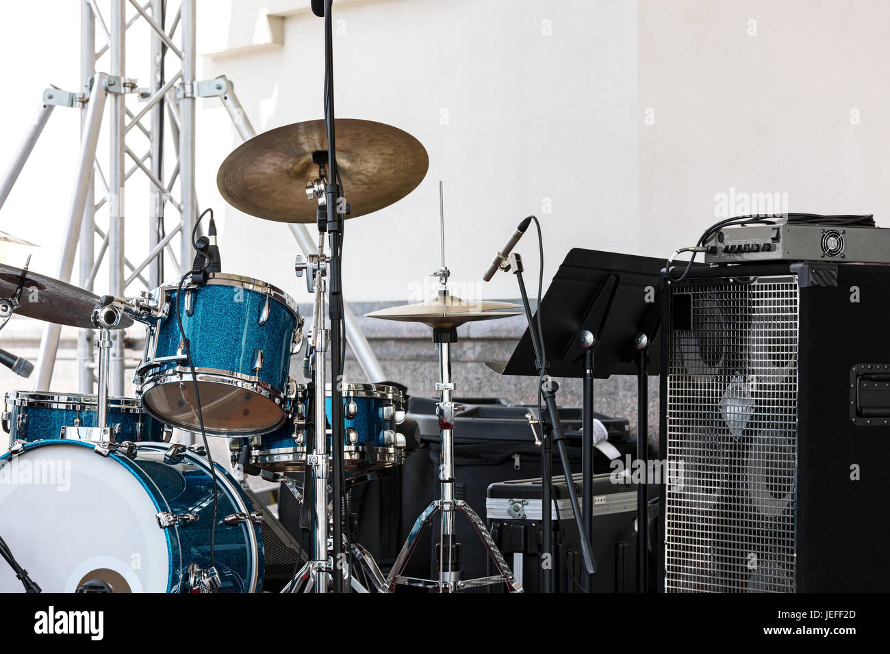 music installation with drums standing outdoors stage before concert ...