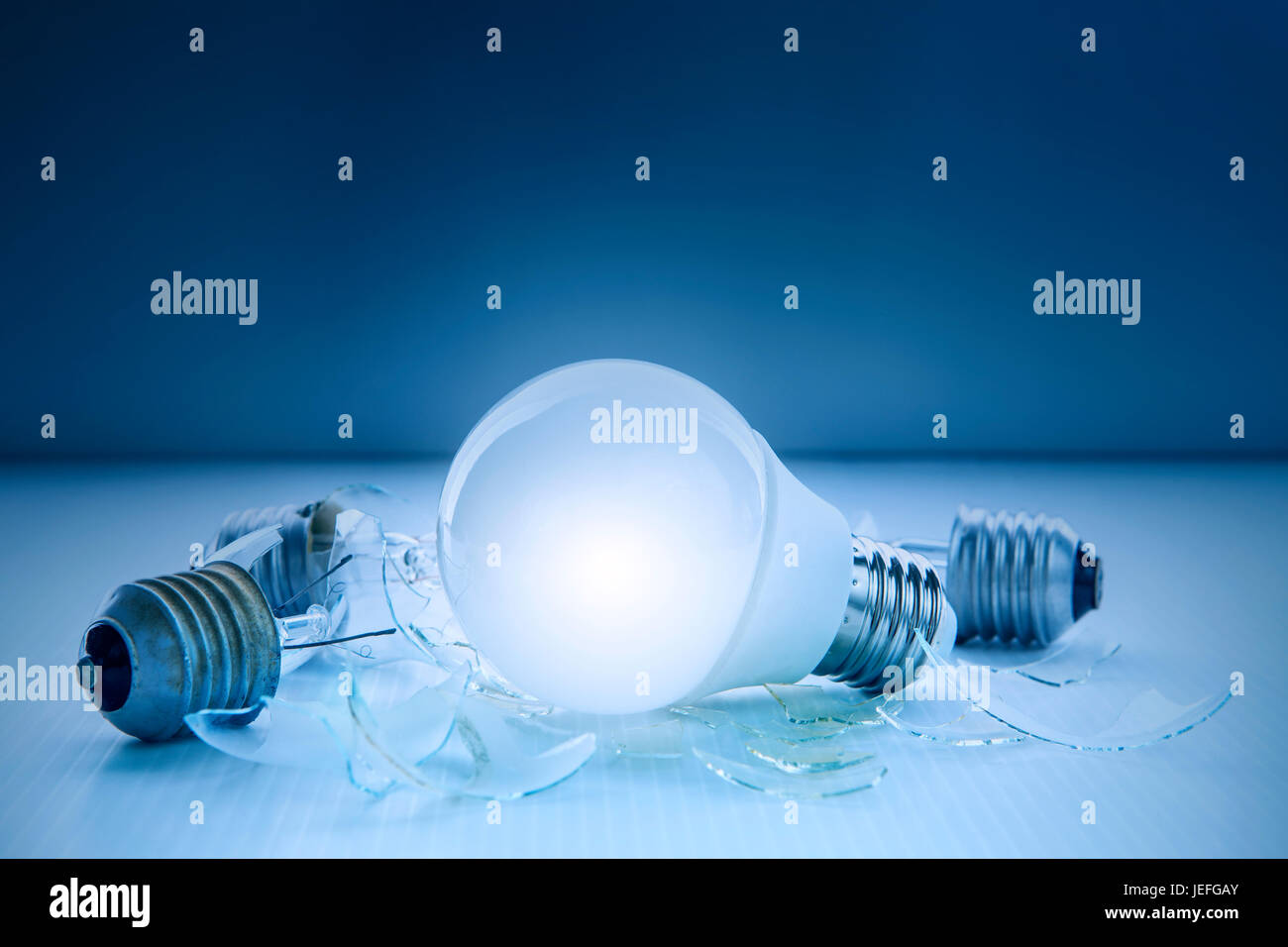 Concept idea broken glowing bulb hi-res stock photography and images ...
