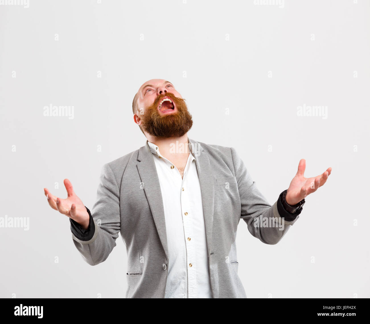 Disgruntled screaming man looking up Stock Photo - Alamy